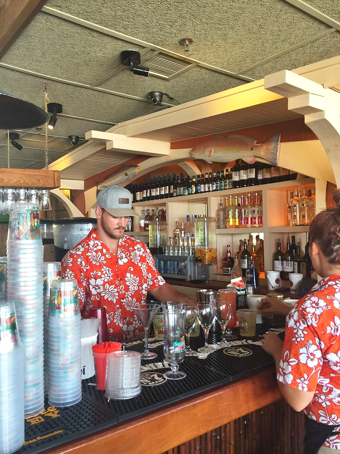 Bartenders in tropical shirts mixing up liquid sunshine. Behind them, fish trophies that didn't end up on your plate watch approvingly.