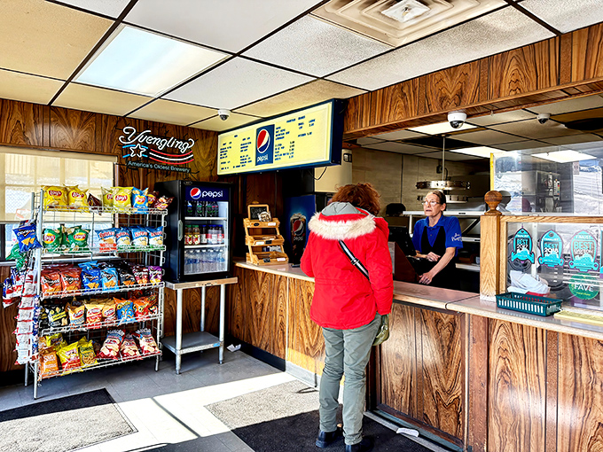 Behind the scenes, pizza artisans work their magic, creating the pies that have kept Daytonians coming back for generations.