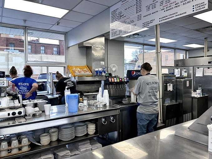 The staff moves with practiced efficiency, flipping burgers with the precision of orchestra conductors. These are the keepers of Wilson's legendary consistency.