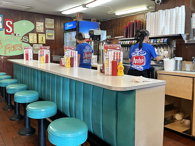The staff moves with the choreographed precision of people who know that ice cream waits for no one, especially in Florida heat.