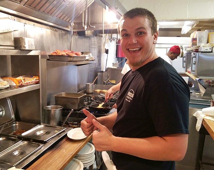 Where the magic happens&mdash;a glimpse into the kitchen where smiles are as genuine as the food. That thumbs-up says everything you need to know.