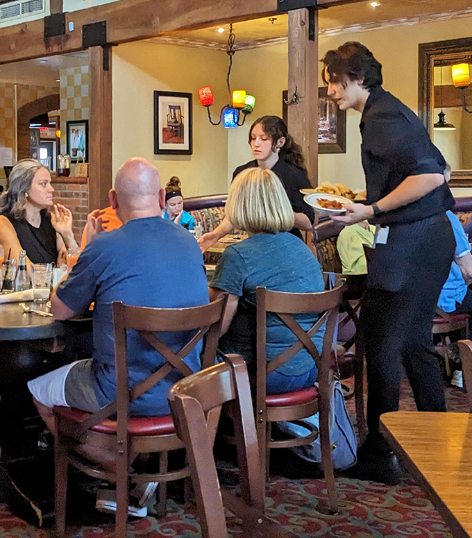 Service with genuine smiles—the kind that can't be trained or faked. That plate being delivered might contain the answer to life's big questions.