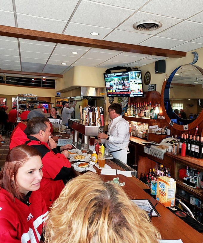 Game day at Blue Moon brings out a sea of Badger red, where strangers become instant friends united by team spirit and shared appetizers.