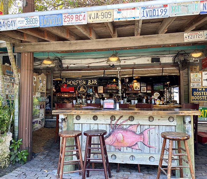 The outdoor bar&mdash;where the hogfish sign isn't just decoration, it's a beacon guiding hungry seafood lovers to their happy place.