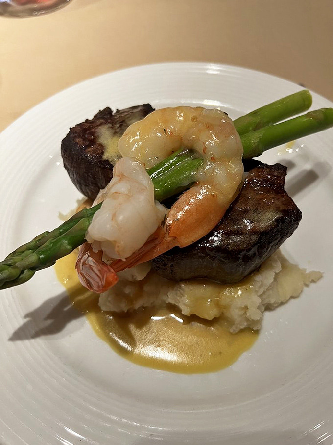 Surf meets turf in perfect harmony. This steak topped with shrimp and asparagus isn't just dinner&mdash;it's land and sea calling a delicious truce.
