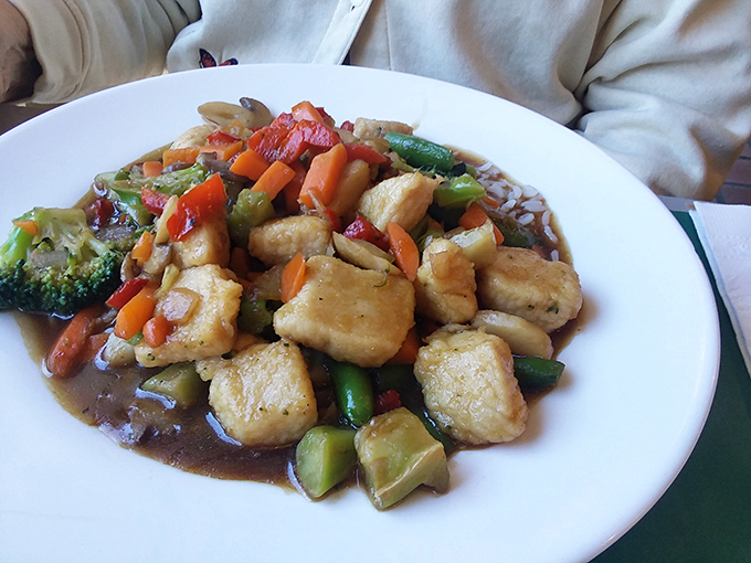This stir-fry isn't just colorful—it's a vegetable United Nations where broccoli, peppers, and carrots live in perfect harmony with golden tofu.