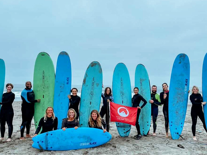 Surf enthusiasts line up their boards like soldiers ready for battle, except this war is against gravity and the only casualties are perfect hairdos.