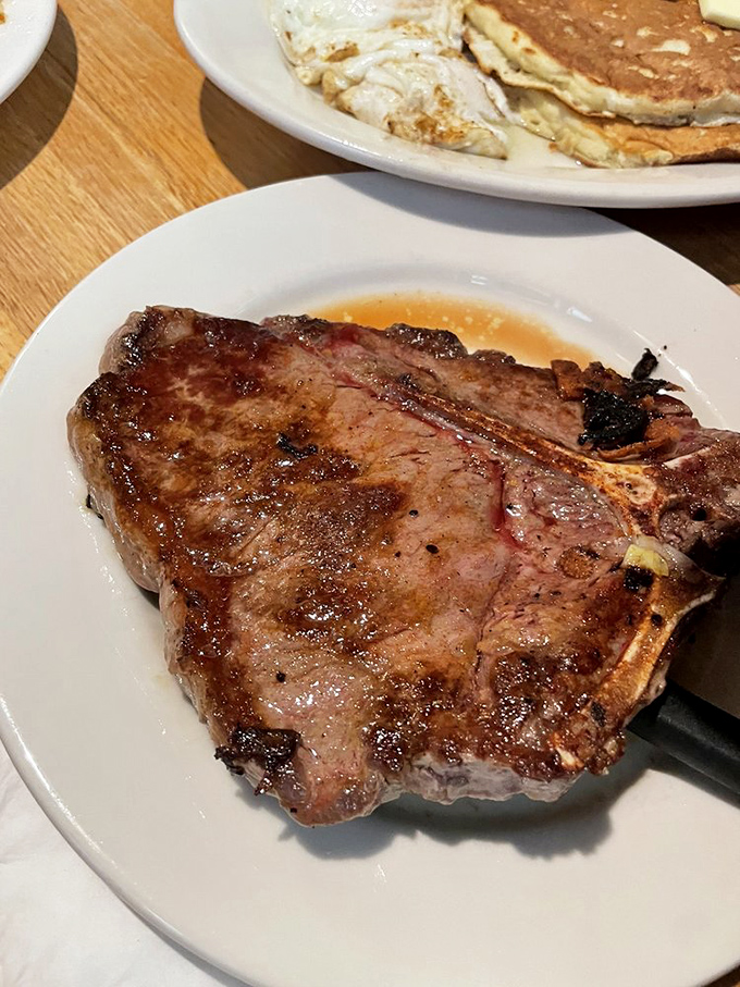 This T-bone steak proves that breakfast places know their way around dinner too, magnificently.