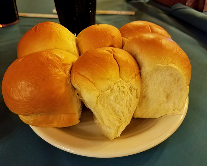 Pillowy dinner rolls that make excellent gravy delivery vehicles. Breaking one open releases a steam cloud that smells like your grandmother's kitchen.