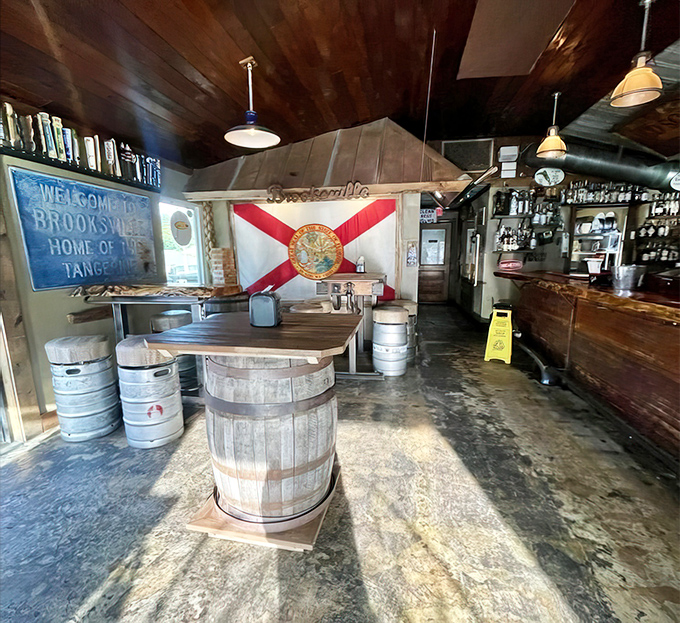 The Florida state flag watches over this rustic taproom like a proud parent. Even the barrels look happy to be here.