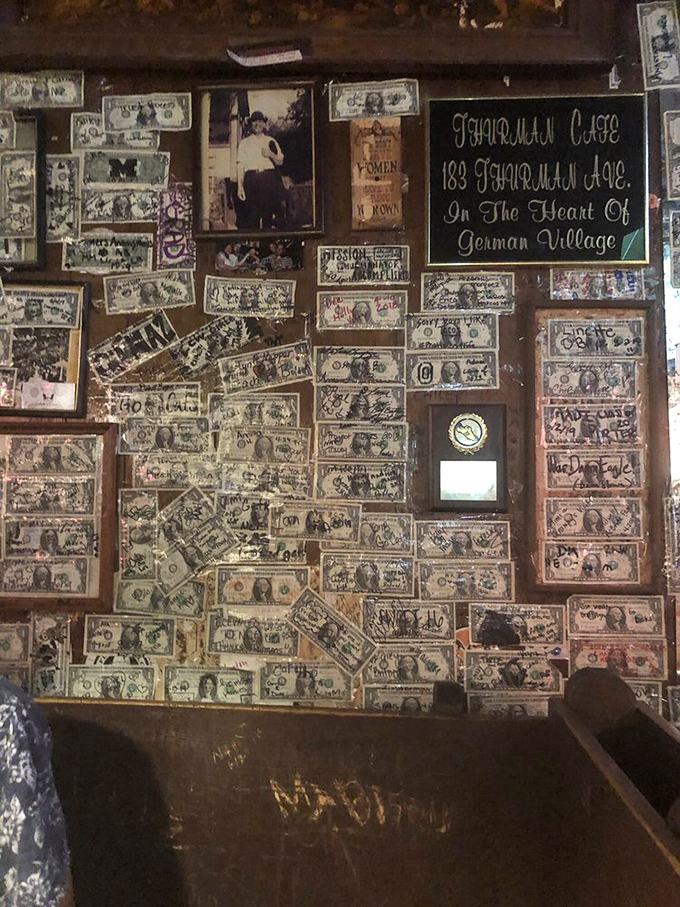 The money wall isn't decoration—it's a ledger of memories. Each dollar tells a story of conquest, celebration, or delicious surrender.