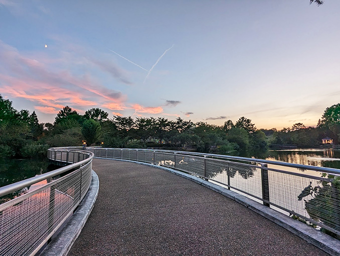 As twilight descends, the garden's curved walkway becomes a journey between two worlds&mdash;daytime reality and evening enchantment.