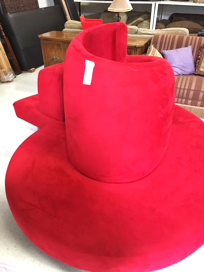 The red conversation piece your living room never knew it needed. Somewhere between sculpture and furniture lies this magnificent curved creation.