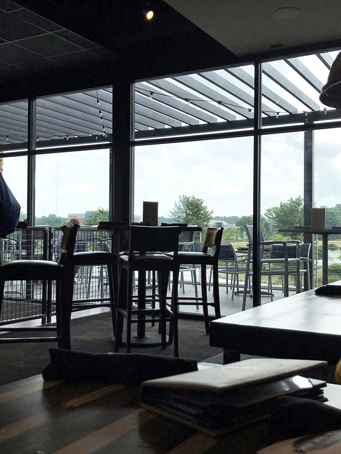 Natural light floods the upper dining area, creating the perfect atmosphere for both serious eating and equally serious conversation.