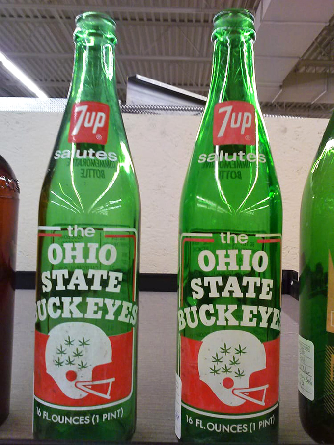 These 7UP bottles celebrate Ohio State Buckeyes glory days – vintage local pride captured in emerald glass that collectors tackle each other for.