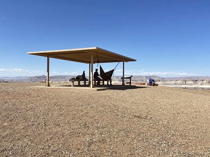The ultimate outdoor living room. Visitors lounge beneath the shelter, contemplating views that make expensive home theater setups seem utterly pointless.