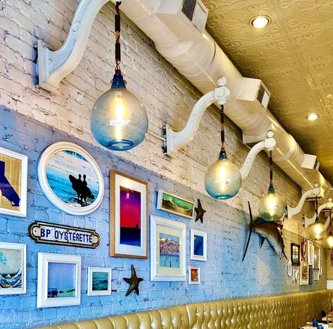 The wall doesn't just have d&eacute;cor, it tells stories&mdash;each frame and pendant light creating the maritime museum of your dreams.