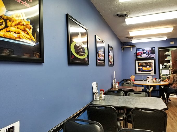 Food photos line the blue walls like a gallery of edible art. More honest than any museum&mdash;you can actually have what you see.