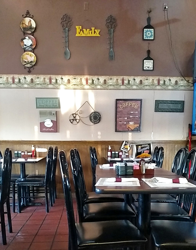 The wall decor screams "FAMILY" louder than your relatives at Thanksgiving dinner. Those oversized utensils aren't subtle, but neither is good home cooking.
