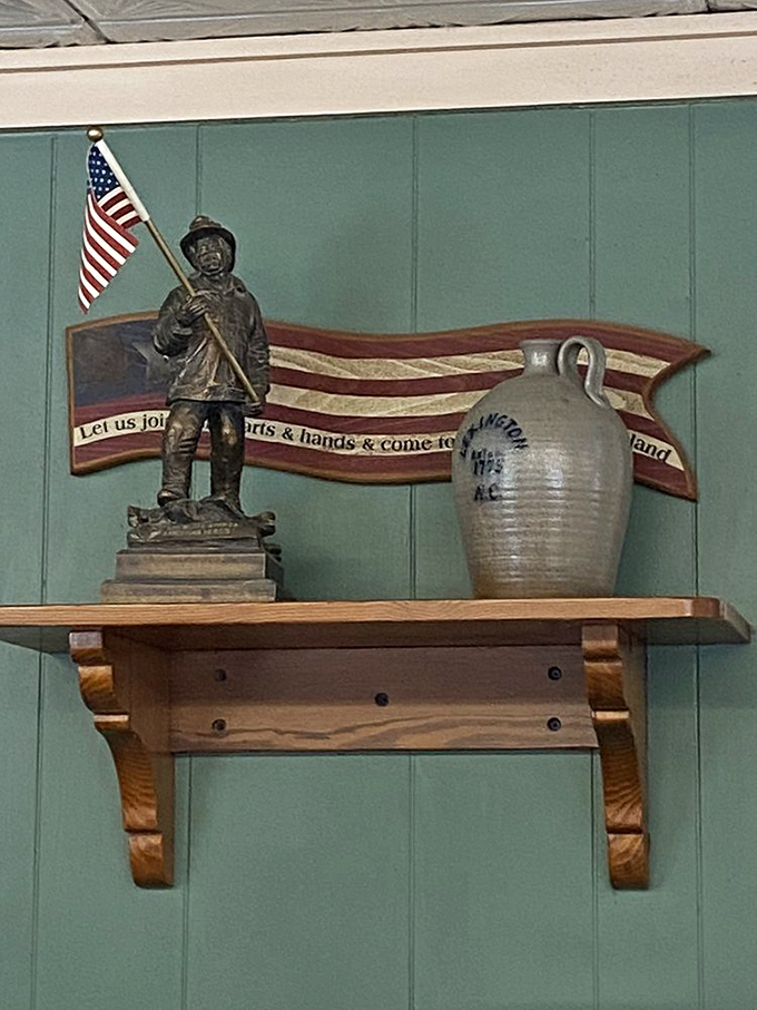 Americana on display: where patriotism meets pottery on a simple wooden shelf. Every barbecue joint needs its shrine to tradition.
