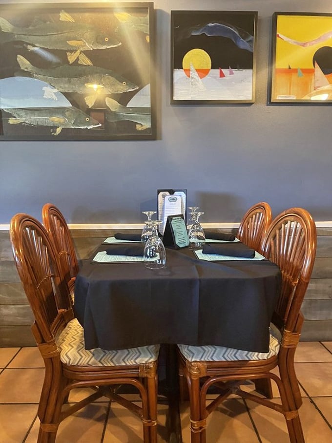 Local artwork transforms dining walls into a coastal gallery, proving good taste extends beyond just what's on your plate.