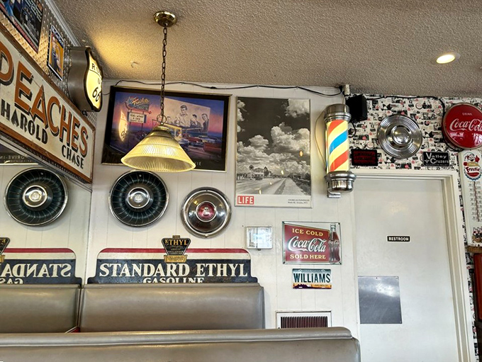The walls tell stories better than most novels. Vintage signs, hubcaps, and memorabilia create the perfect backdrop for comfort food conversations.
