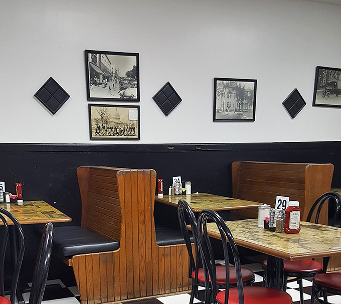 Historical photos watching over diners like ancestors at a family reunion. These walls have absorbed more local gossip than any newspaper.