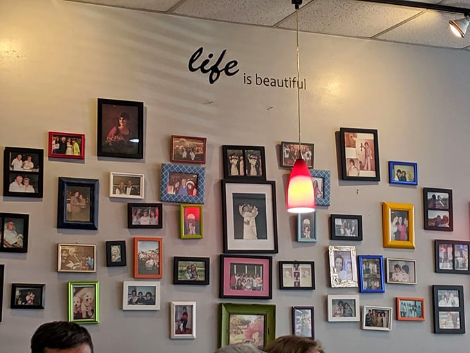 "Life is beautiful" indeed, especially with good food. The wall of family photos reminds us that restaurants are about more than just eating.