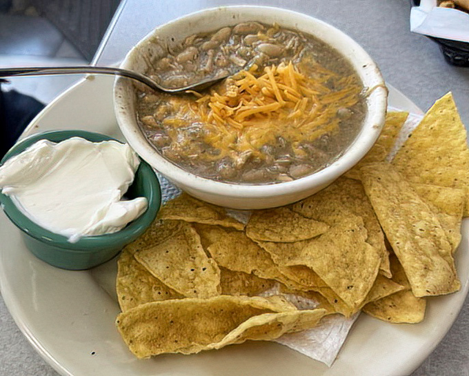 White chicken chili with a side of tortilla chips&mdash;the kind of hearty bowl that makes you forget about fancy food and remember what eating is really about.