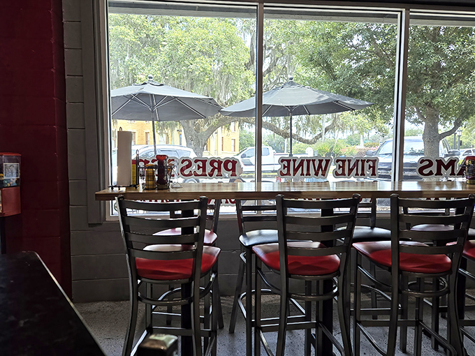 Window seats that let you contemplate the outside world while remaining firmly committed to your BBQ journey. Red accents remind you passion is on the menu.