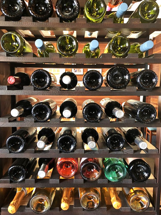 The wine rack—because sometimes breakfast extends into lunch, and sometimes lunch deserves a little celebration.