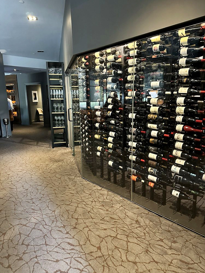 Wine bottles standing at attention like soldiers guarding liquid treasures. Each one a potential perfect partner for your beef affair.