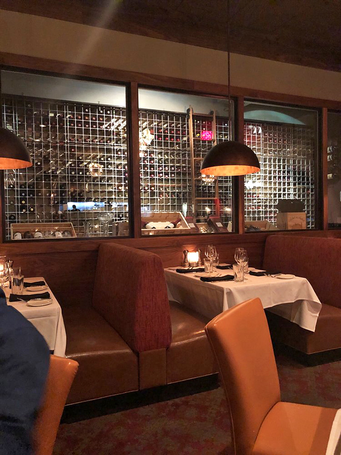 The wine display isn't just storage&mdash;it's a gallery exhibition where every bottle tells a story waiting to be uncorked.