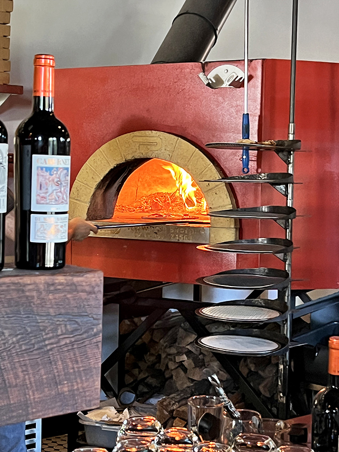 This wood-fired oven is where the real magic happens, transforming simple dough into crispy, smoky perfection.