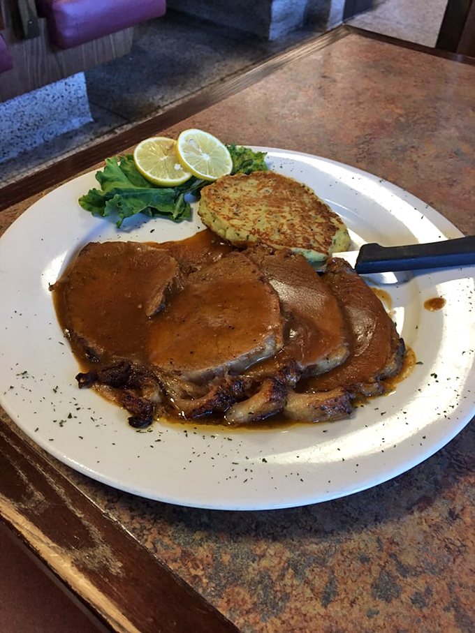 Yankee pot roast that falls apart at the mere suggestion of your fork, bathed in a gravy worth bottling and taking home.