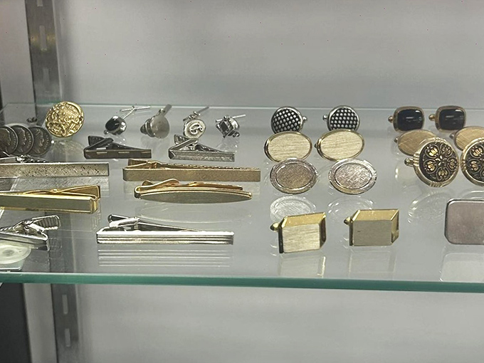 Cufflinks and tie clips arranged with museum-worthy precision&mdash;proving that even the smallest accessories deserve the spotlight.
