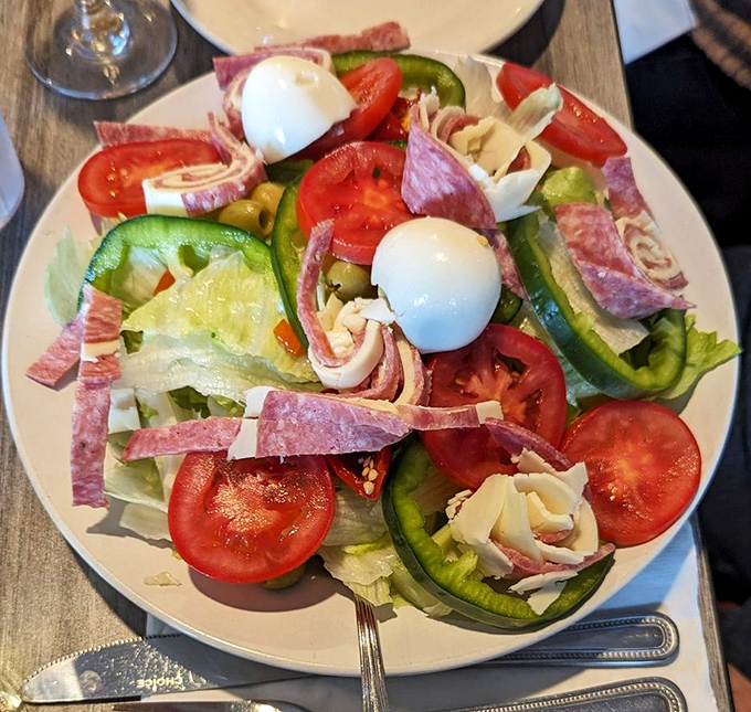 A salad that refuses to be boring &ndash; fresh vegetables, savory meats, and creamy mozzarella create a symphony of flavors and textures.