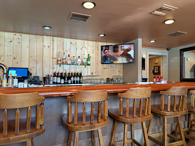 A bar that invites you to pull up a stool and stay awhile. Classic wooden chairs and a well-stocked shelf promise good conversations and better drinks.