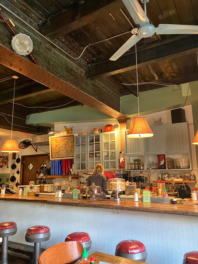 The counter seating offers front-row tickets to the breakfast show. Those pendant lamps cast the perfect glow on your morning feast.