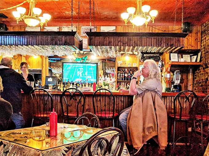 The bar area&mdash;where strangers become friends and regulars are treated like royalty. That warm wooden glow makes every beer taste better and every story more interesting.