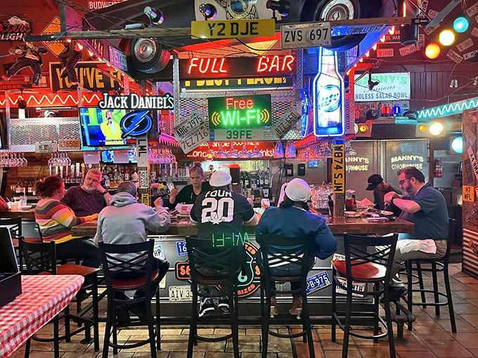 The full bar promises cold drinks to complement hot steaks in this lively atmosphere.