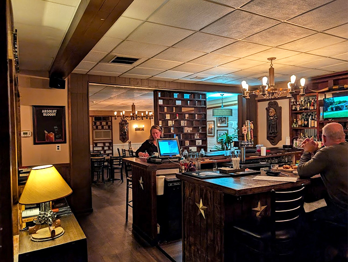 The bar area balances Western charm with modern comfort. It's where strangers become friends over perfectly mixed Old Fashioneds and tales of great steaks past.