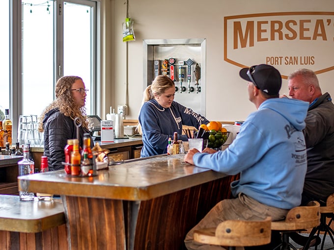 The bar area buzzes with locals and visitors alike, all united in their quest for great seafood and good times.