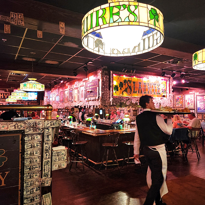 The bar where dollars decorate every surface and Tiffany-style lamps cast the perfect glow for making questionable decisions about that second pint.