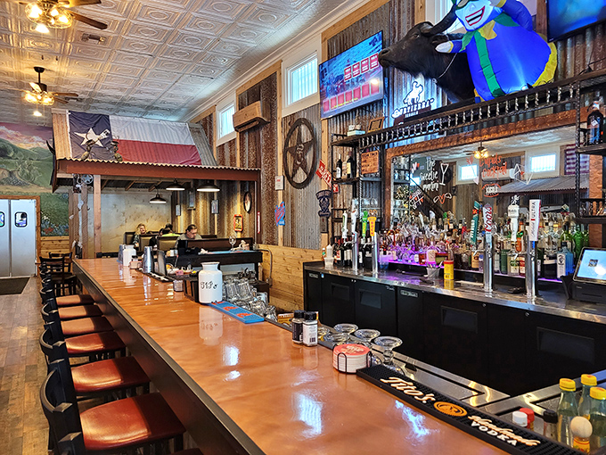 The bar where strangers become friends and friends become family. Those Texas flags aren't decorations &ndash; they're declarations of delicious intent. 