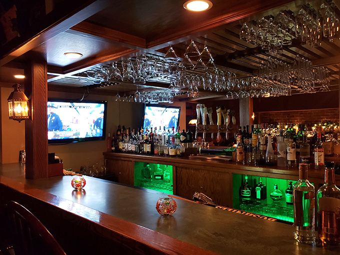 The bar isn't just well-stocked&mdash;it's a liquid library of possibilities with glasses hanging like crystal stalactites from the ceiling.