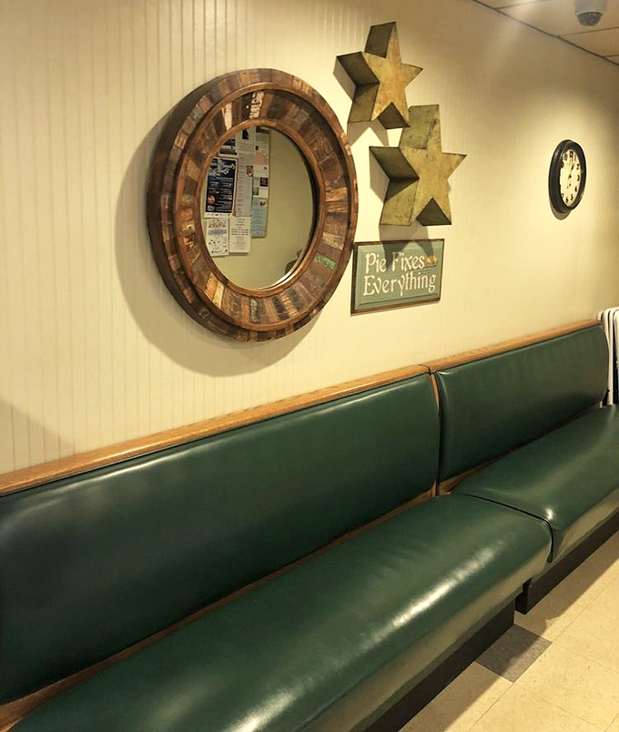That "Pie Fixes Everything" sign isn't just decoration&mdash;it's the restaurant's philosophy in three perfect words. The green booths have cradled generations of diners.