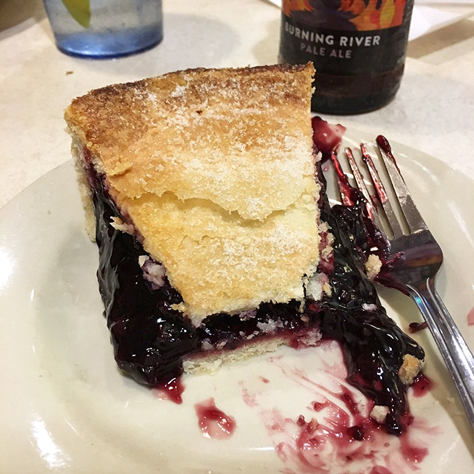 This slice of black raspberry pie isn't just dessert&mdash;it's a purple-hued reminder that some pleasures in life are worth every single calorie.