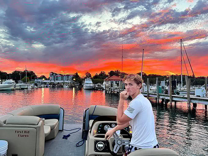 Lake Huron sunsets paint the sky in impossible colors, turning an ordinary boat ride into a memory that will outlast summer.