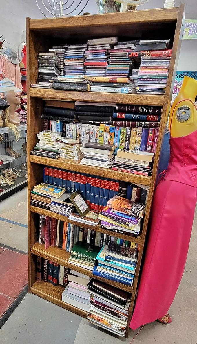 Books, CDs, and cassettes stack neatly on wooden shelves&mdash;a time capsule of entertainment from the pre-streaming era when media took physical form.